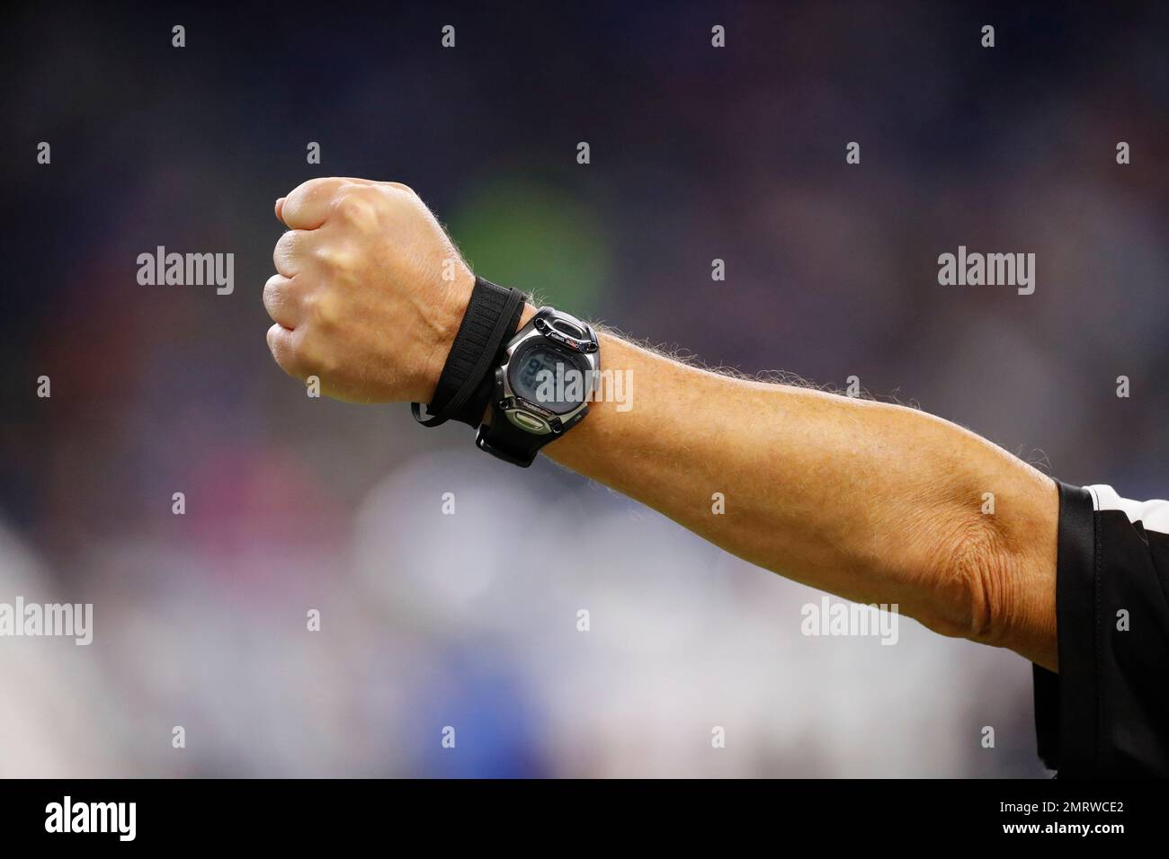 A referee signals during the second half of an NFL preseason football ...