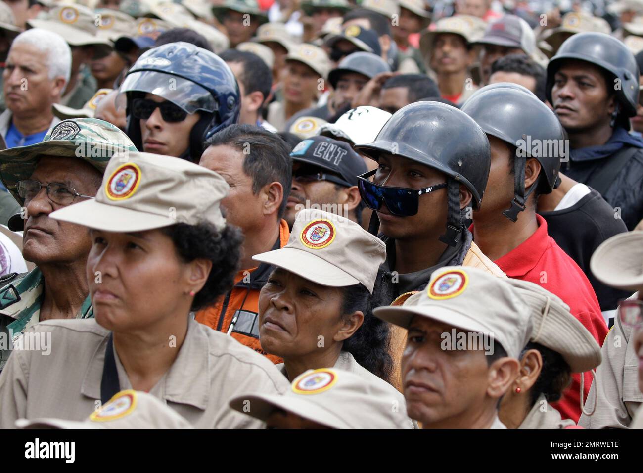 Militia members listen to Gen. Carlos Leal Telleria, commander of the ...