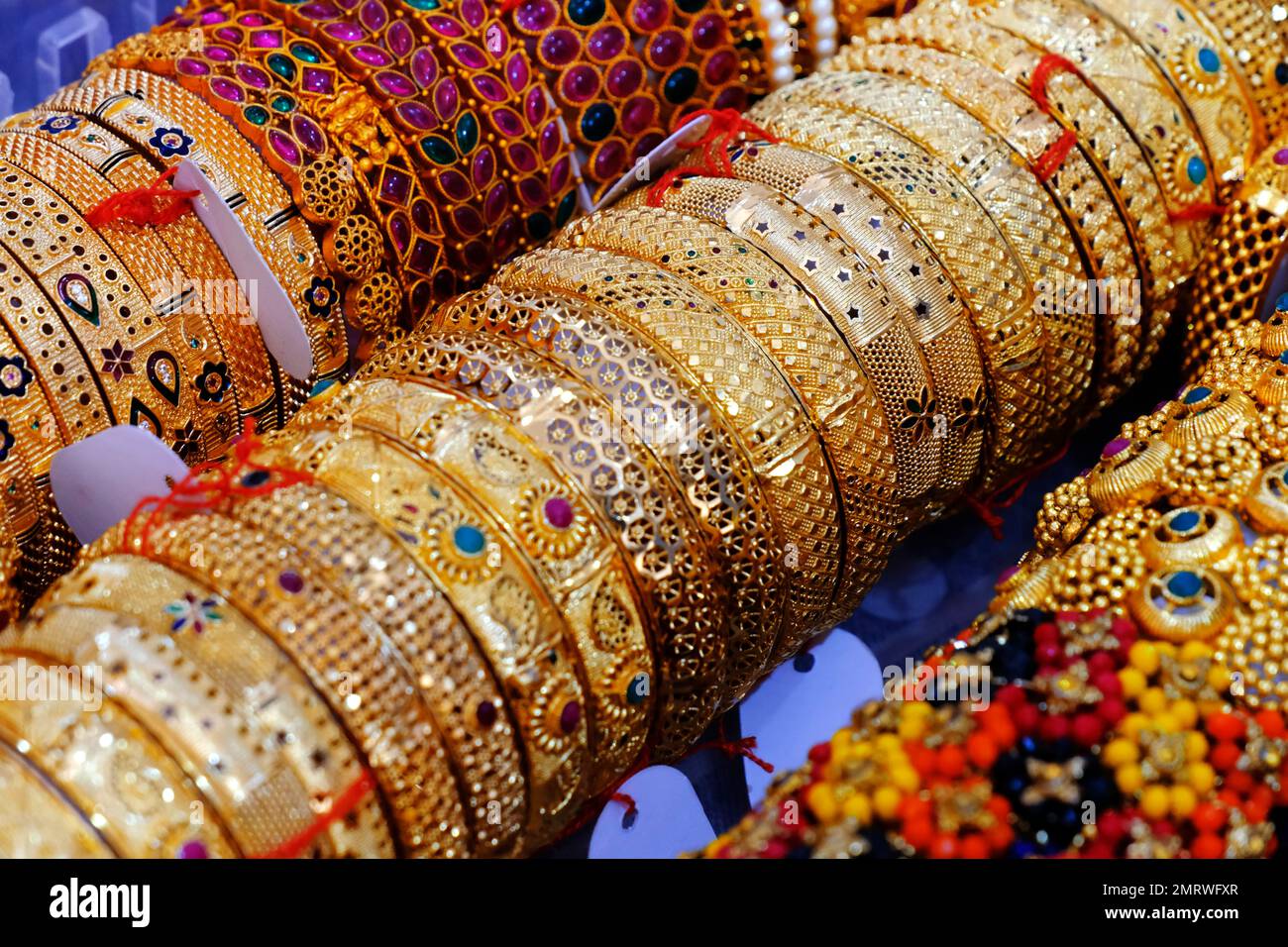 Indian colorful bangles displayed in local shop in a market of Pune ...
