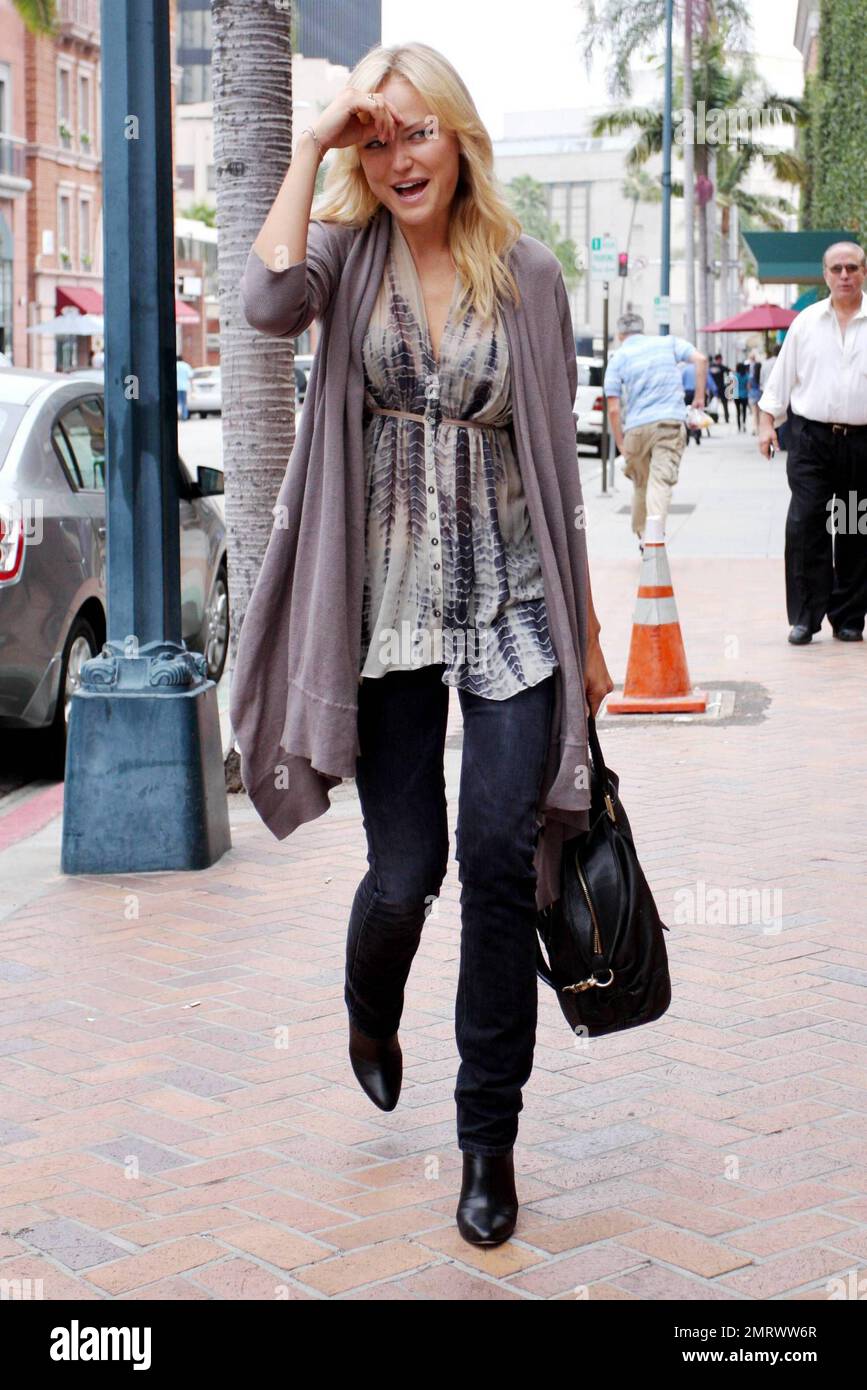 "Watchmen" actress Malin Akerman playfully covers her face from ...