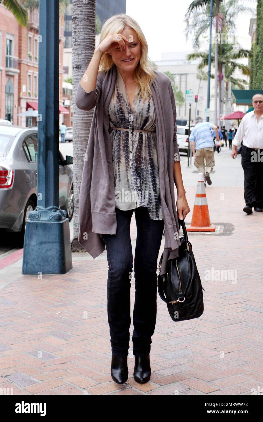 "Watchmen" actress Malin Akerman playfully covers her face from ...