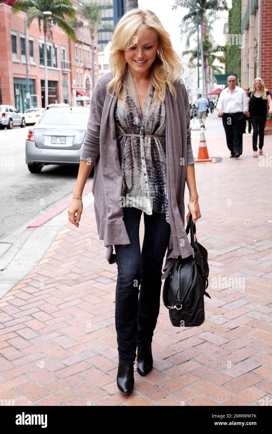 "Watchmen" actress Malin Akerman playfully covers her face from ...