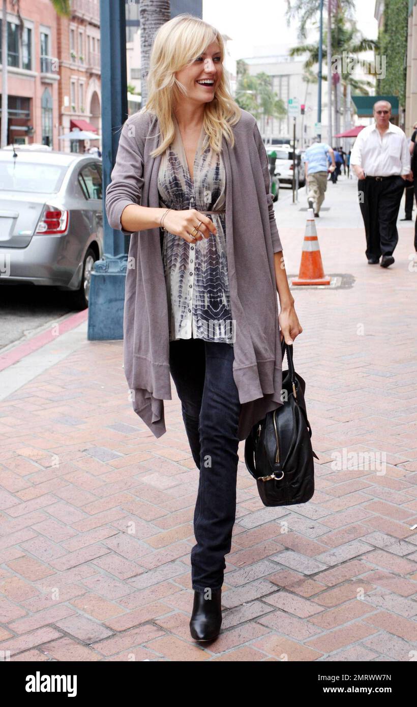 "Watchmen" actress Malin Akerman playfully covers her face from ...