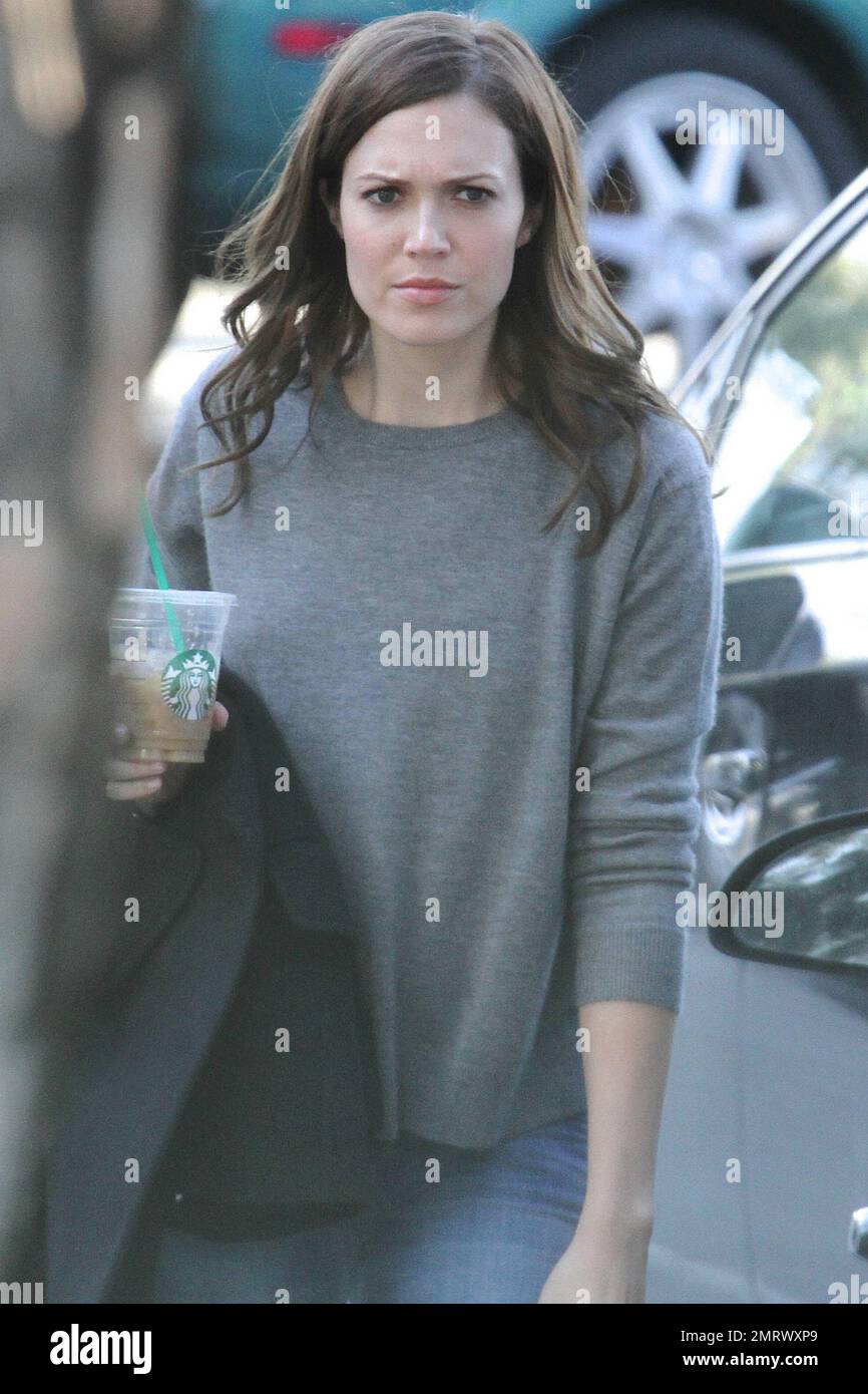 EXCLUSIVE!! Wearing a grey sweater and sipping a drink from Starbucks ...
