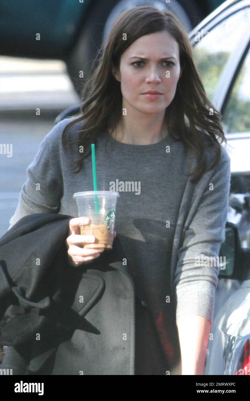 EXCLUSIVE!! Wearing a grey sweater and sipping a drink from Starbucks ...