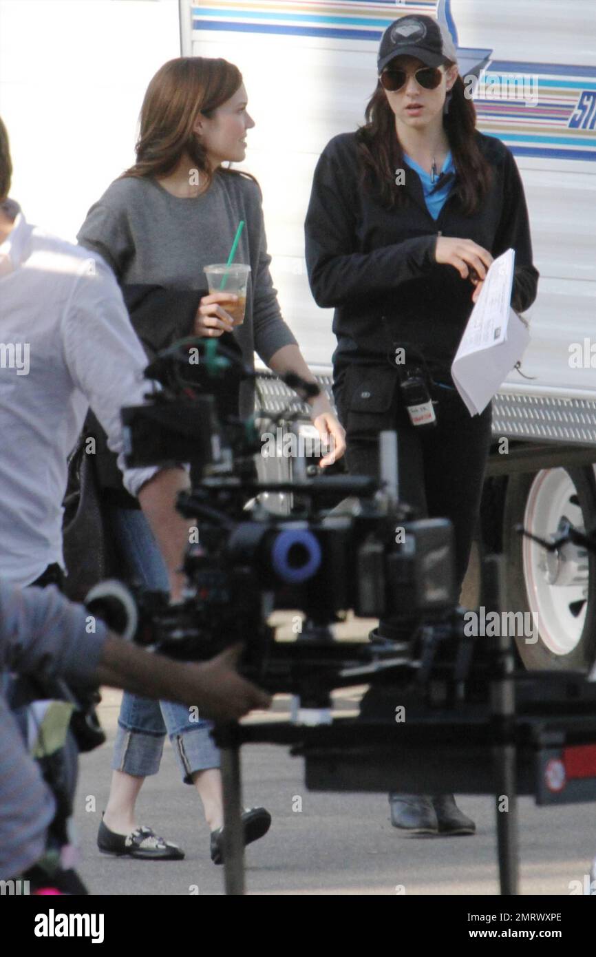 EXCLUSIVE!! Wearing a grey sweater and sipping a drink from Starbucks ...