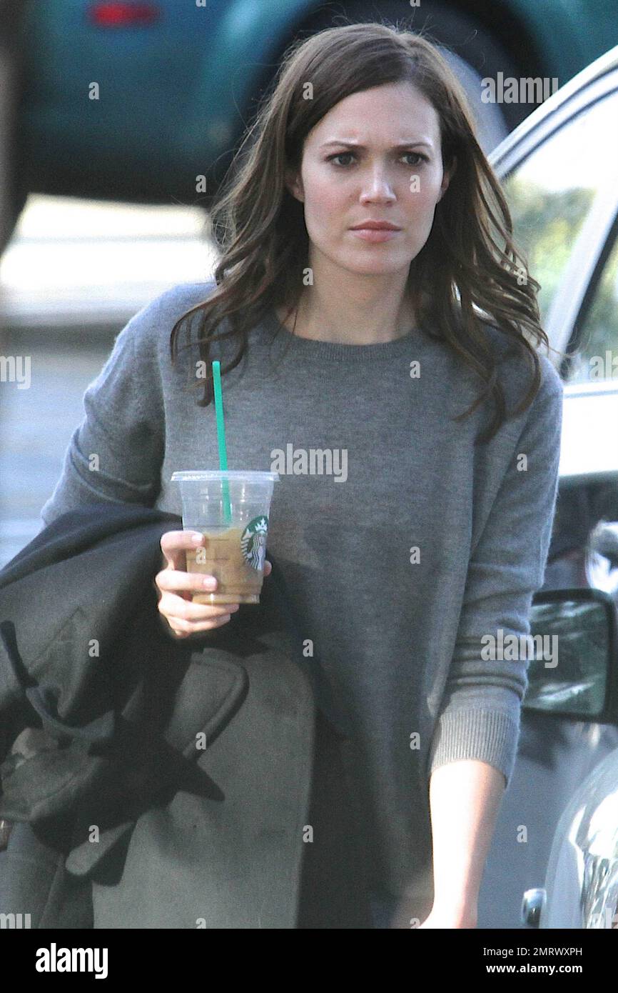 Exclusive Wearing A Grey Sweater And Sipping A Drink From Starbucks Actress Mandy Moore Looks