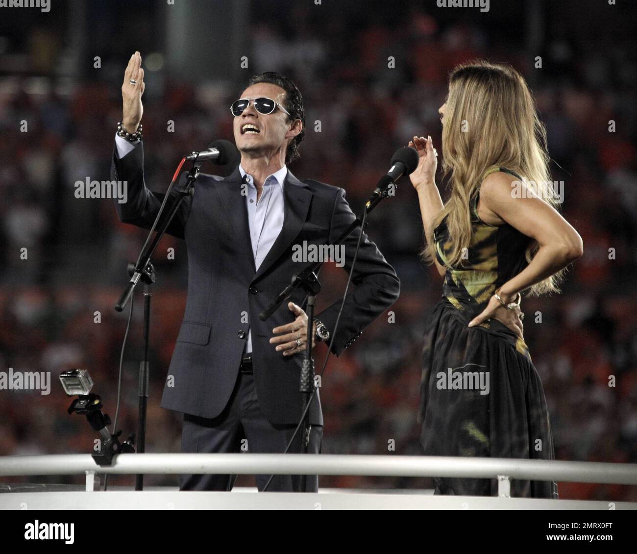 Singers Marc Anthony and Fergie (aka Stacy Ferguson) sing the national ...