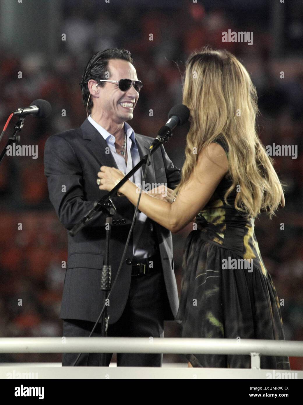 Singers Marc Anthony and Fergie (aka Stacy Ferguson) sing the national ...