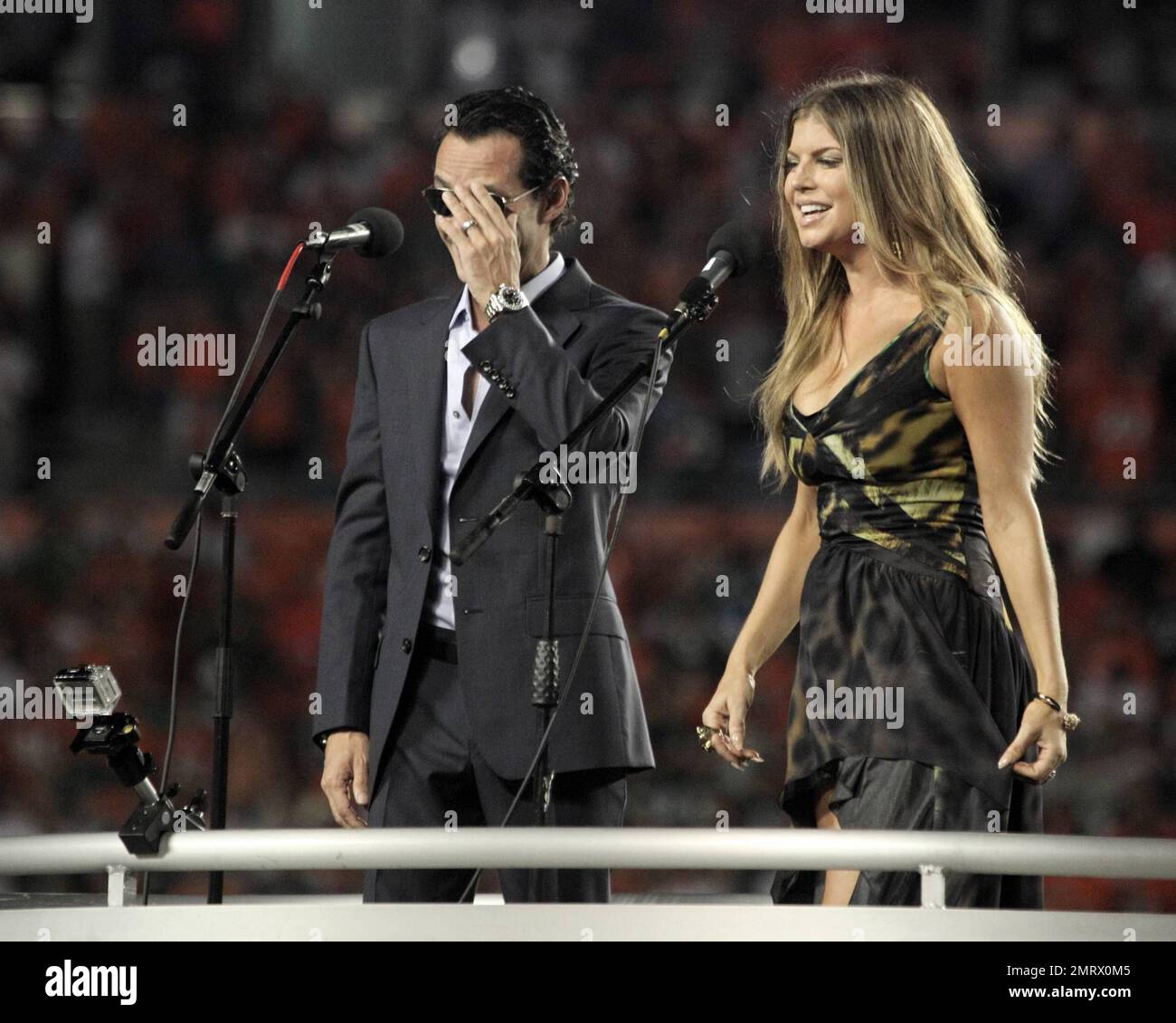 Singers Marc Anthony and Fergie (aka Stacy Ferguson) sing the national ...