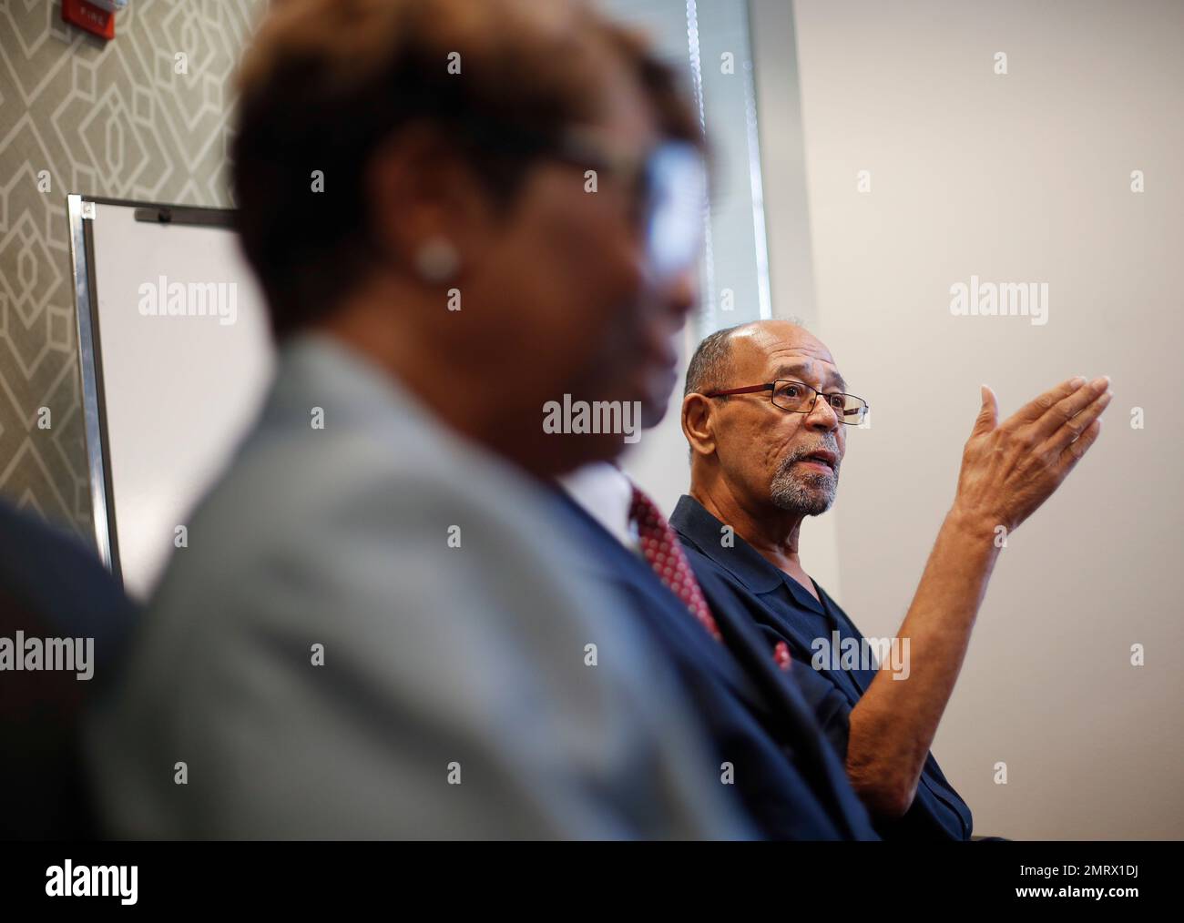 Phillip Butler, right, accompanied by his wife Barbara Butler, left ...