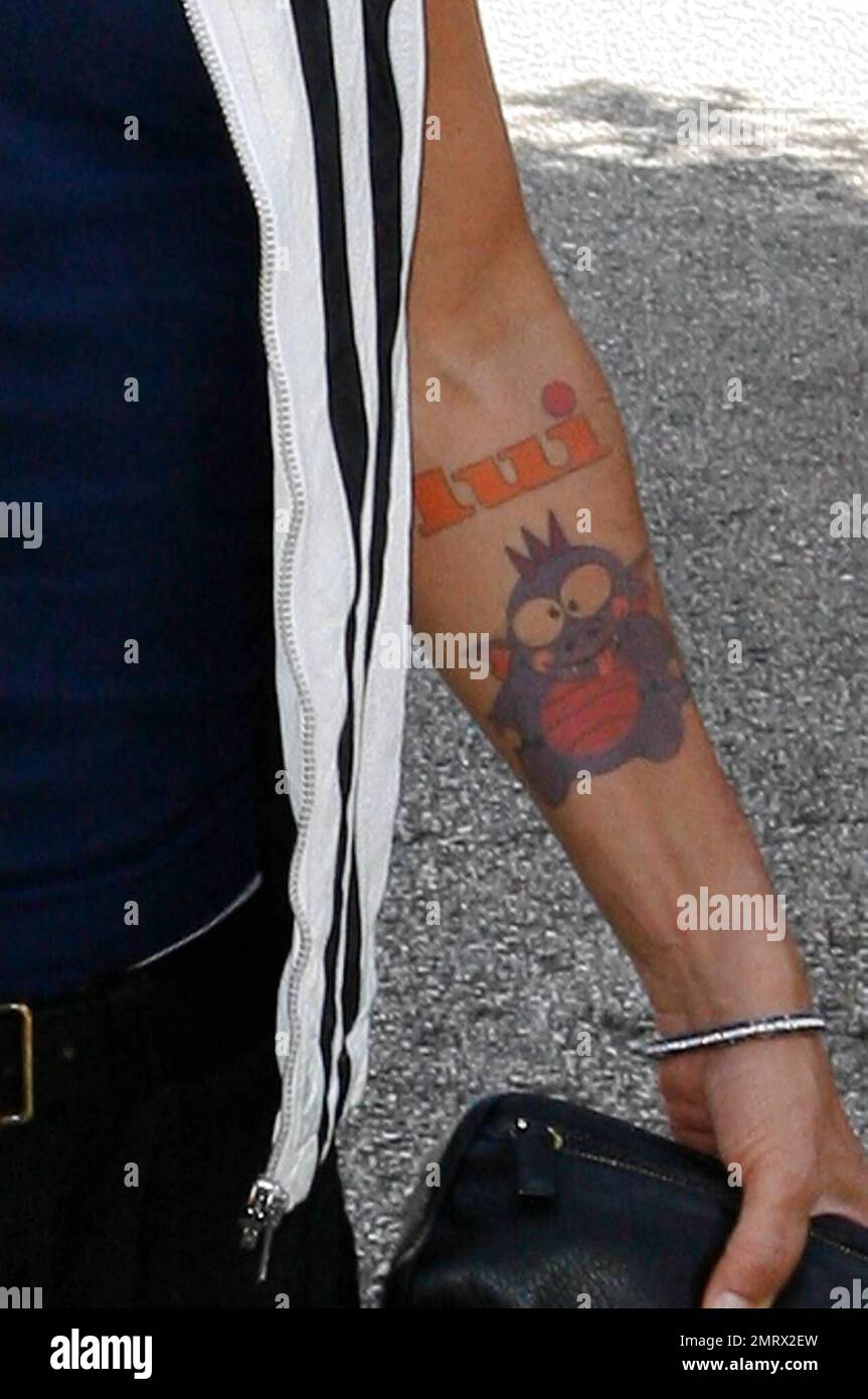 Marc Jacobs, sporting tattoos including Spongebob Squarepants and an M ...