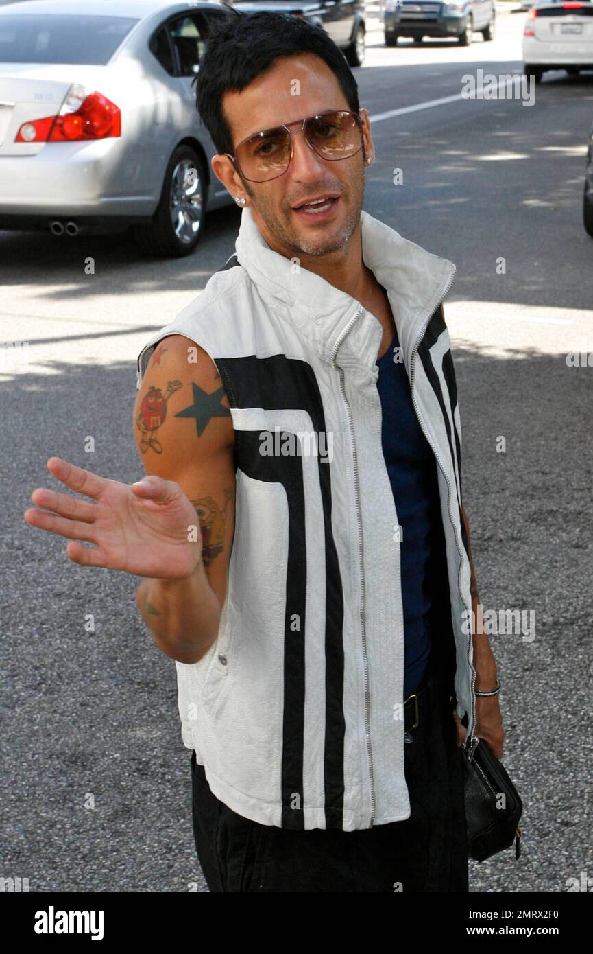 Marc Jacobs, sporting tattoos including Spongebob Squarepants and an M ...