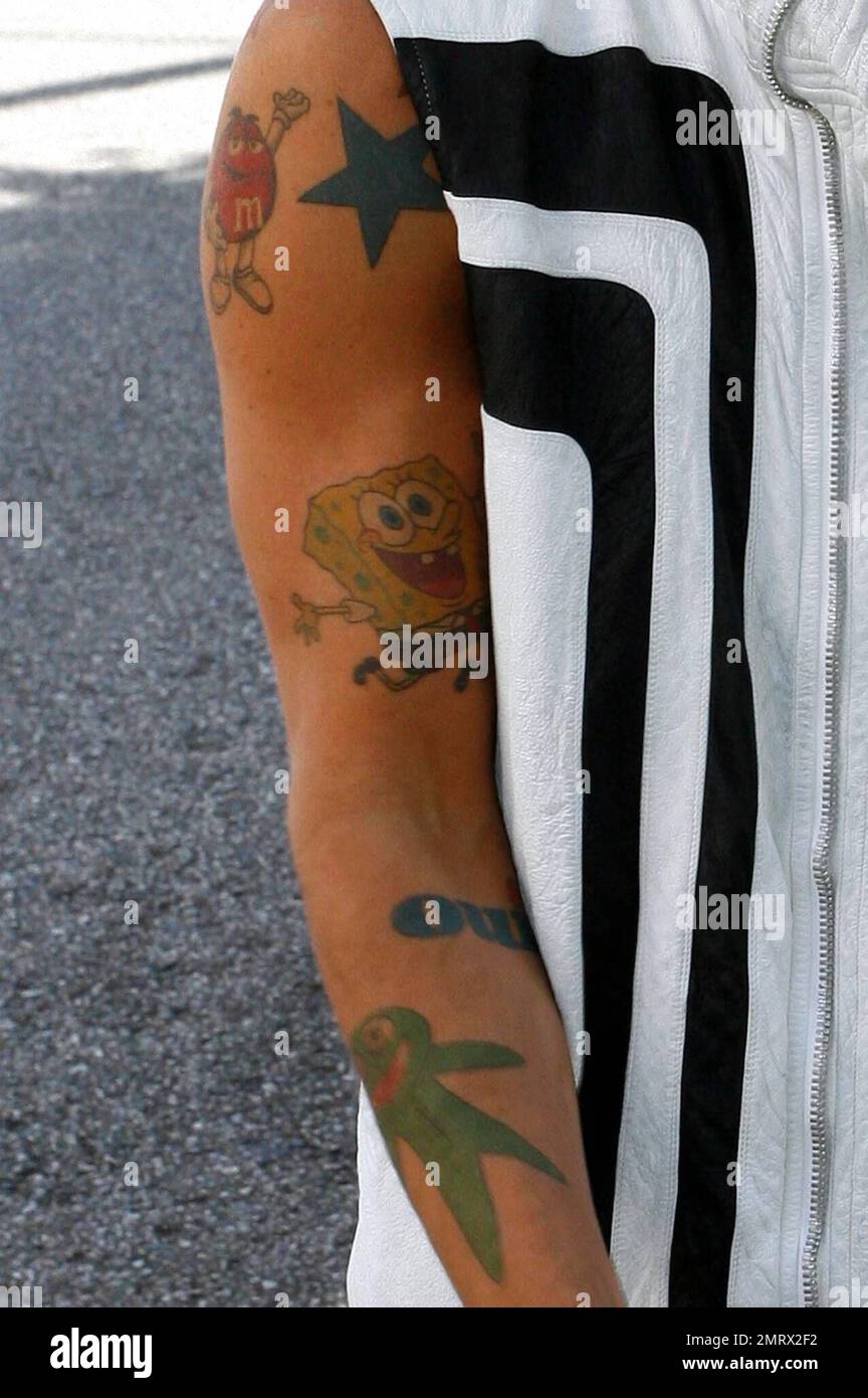 Marc Jacobs, sporting tattoos including Spongebob Squarepants and an M ...