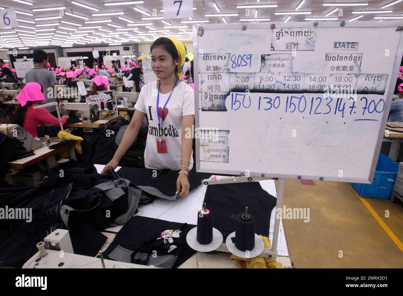 A Cambodian garment worker is seen at a factory as they wait for ...