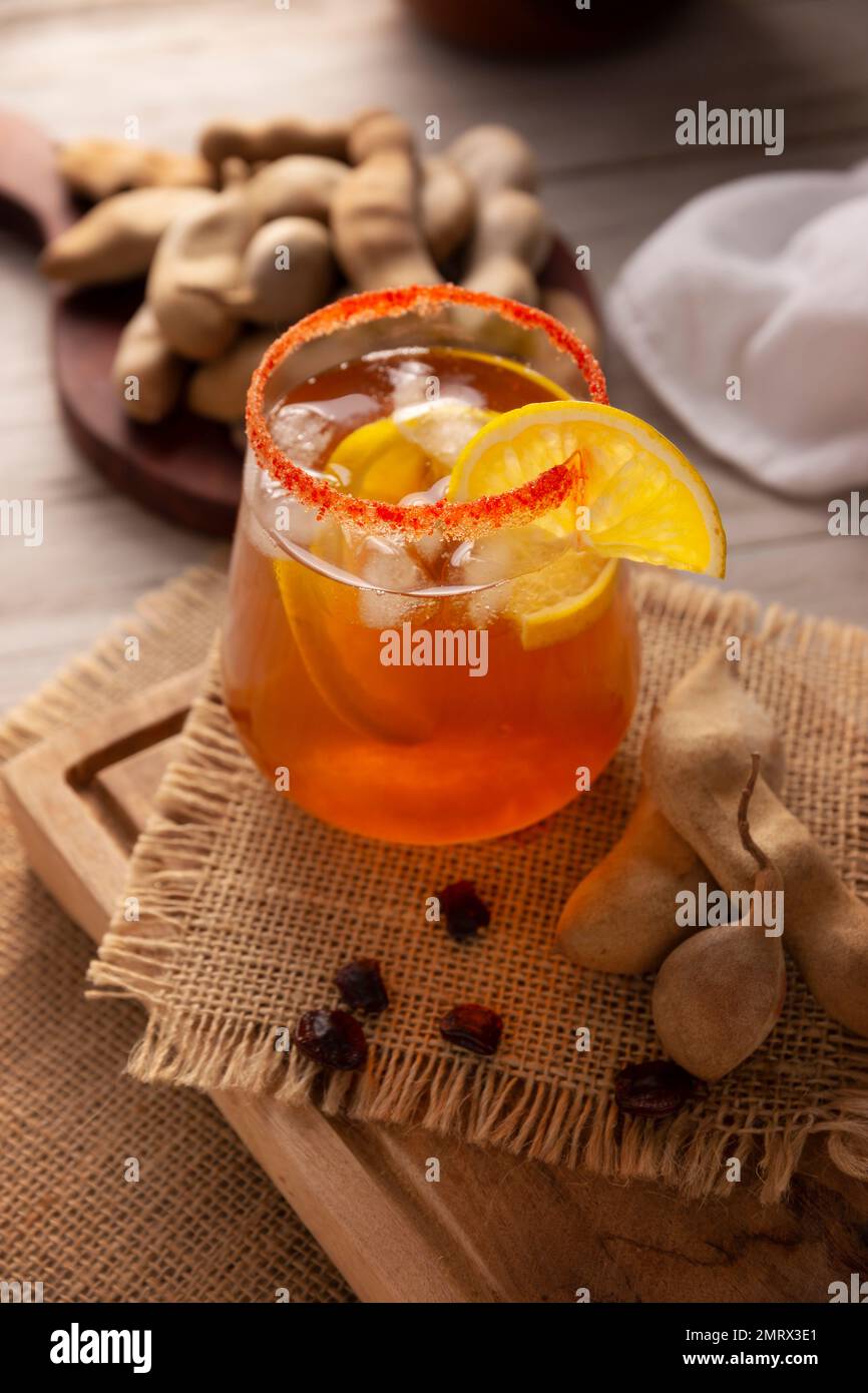 Agua de Tamarindo, is one of the traditional "Aguas Frescas" in Mexico. Infused drink made with ...