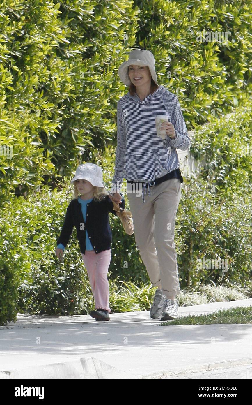 Actress Marcia Cross goes for a casual stroll with her daughter taking ...