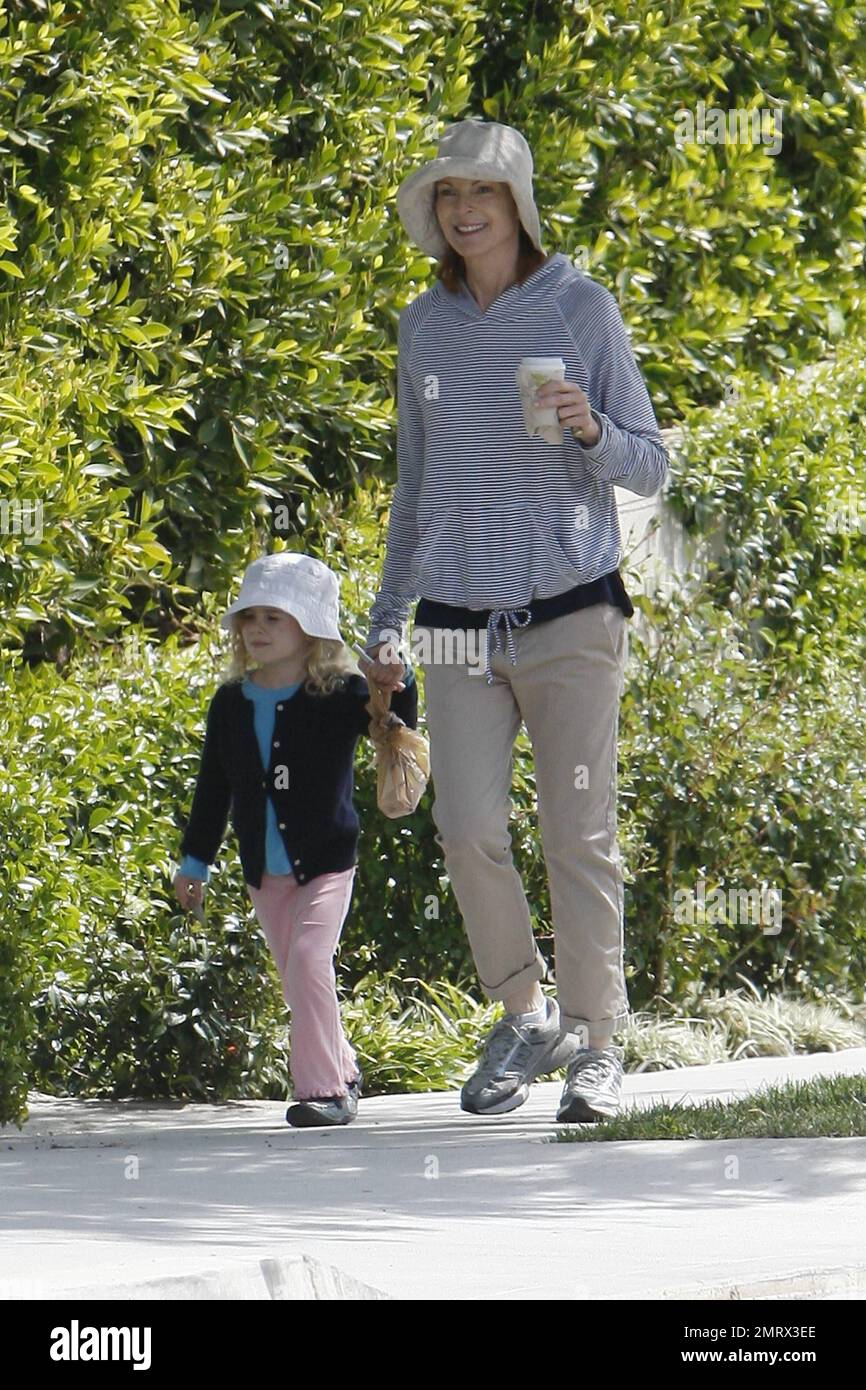 Actress Marcia Cross goes for a casual stroll with her daughter taking ...