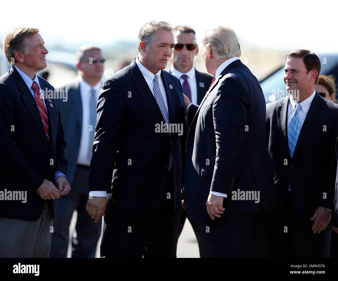 President Donald Trump speaks with Rep. Trent Franks, R-Ariz., third ...