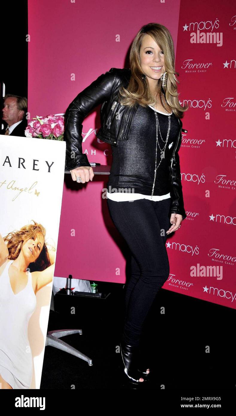 Mariah Carey, wearing an all-black outfit, launches her new fragrance ...