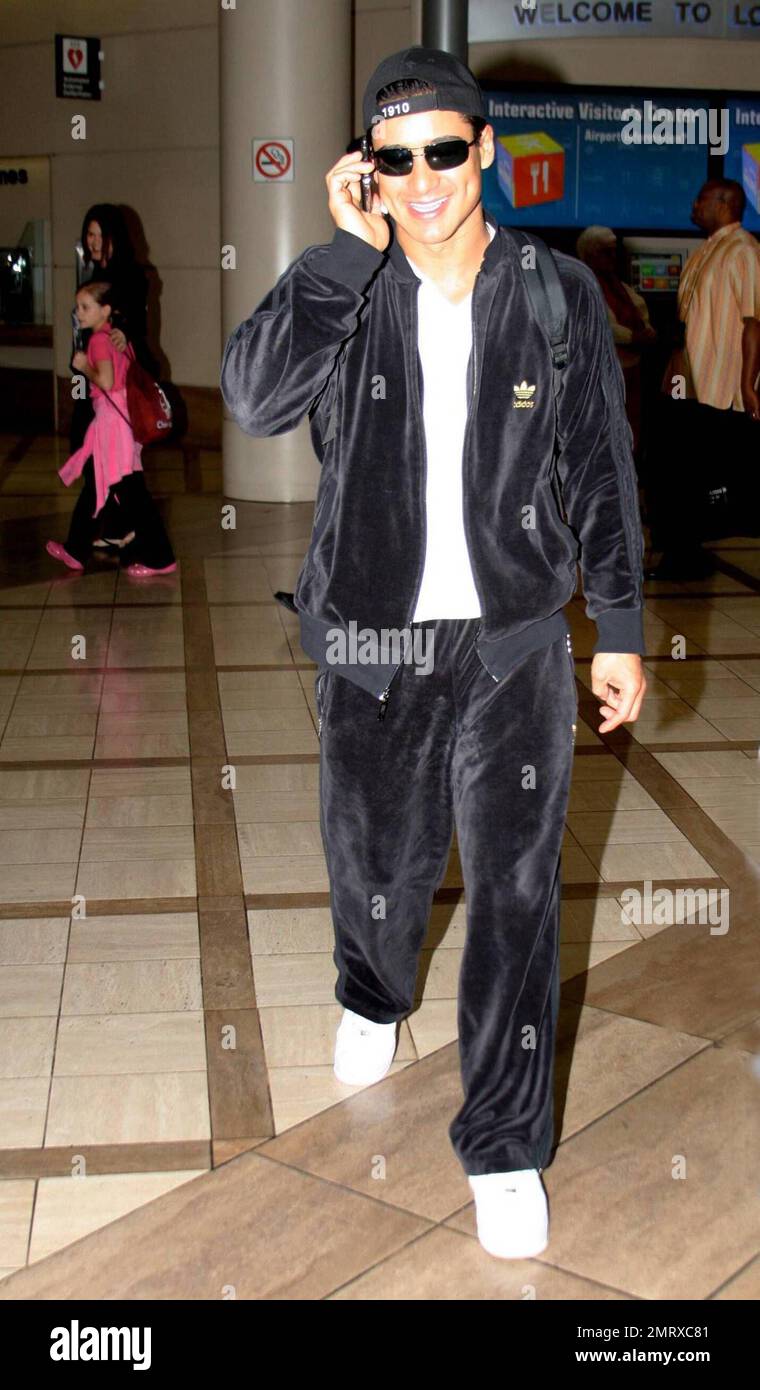 Mario Lopez is all smiles as he arrives at LAX on a flight from Miami ...