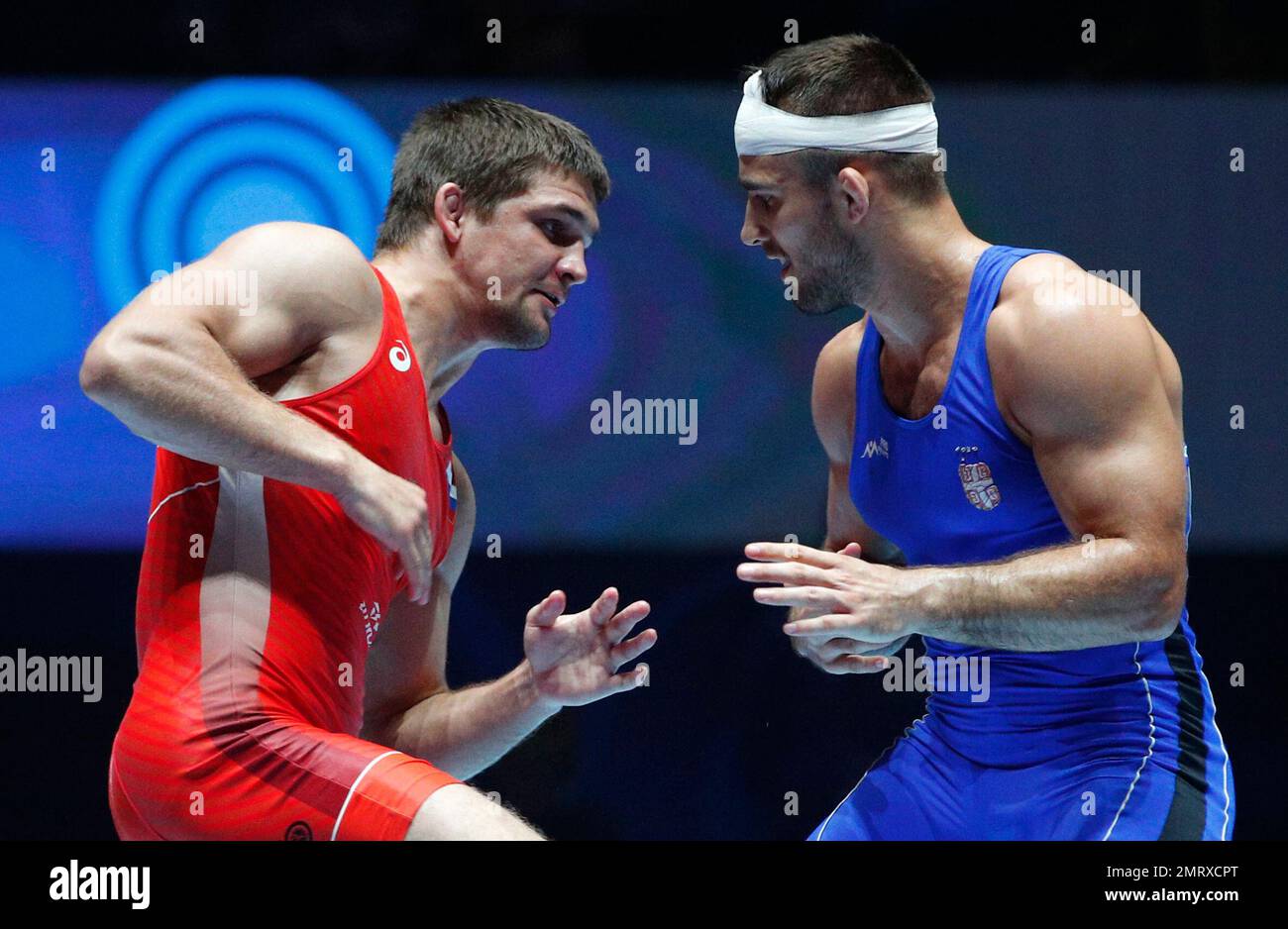 Russia's Alexander Chekhirkin, red, and Serbia's Viktor Nemes compete ...