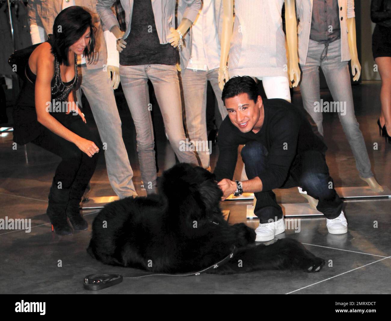 Actor Mario Lopez and girlfriend Courtney Mazza shop at Armani Exchange ...