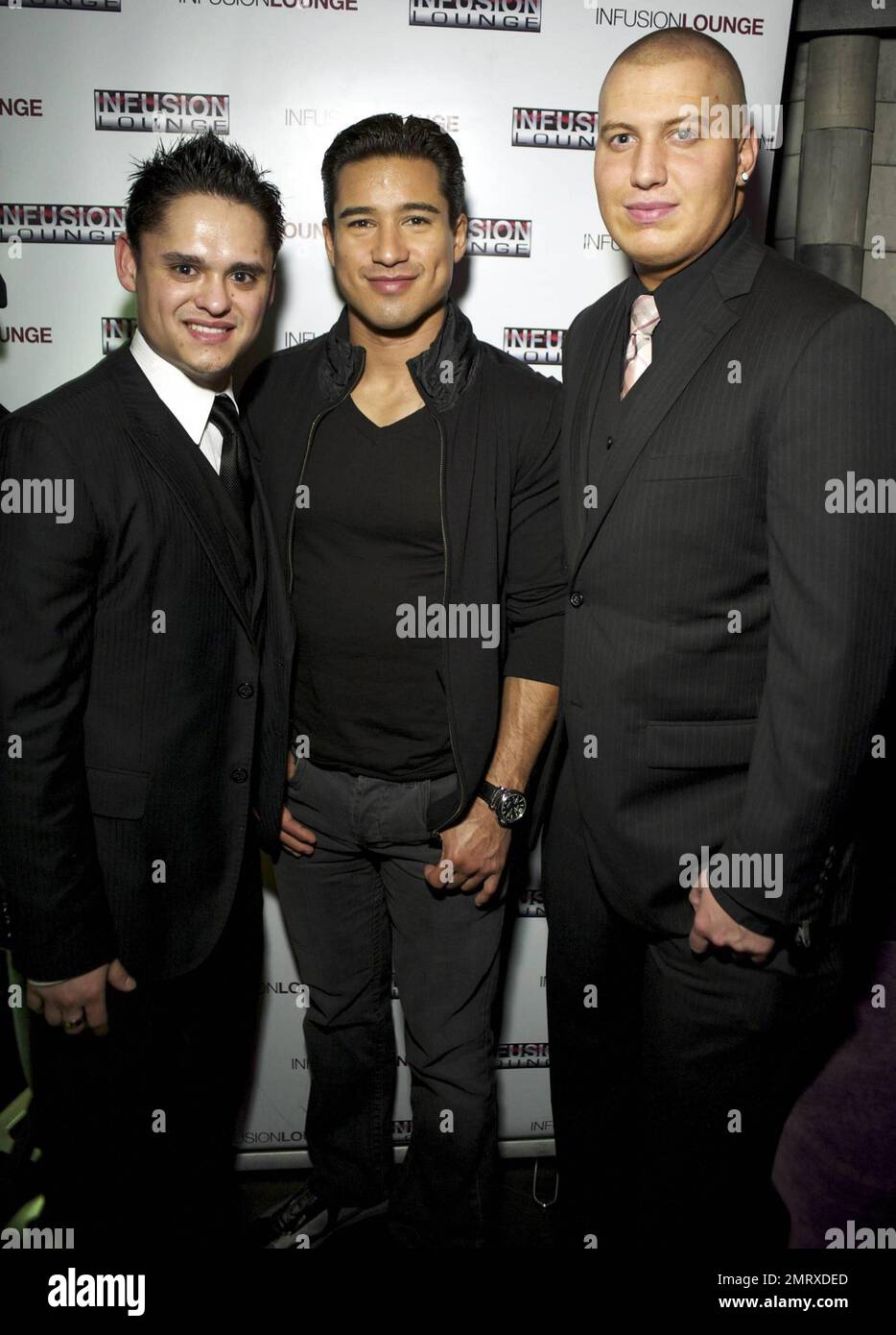 EXCLUSIVE!! "Extra" host Mario Lopez poses for photos with fans during ...