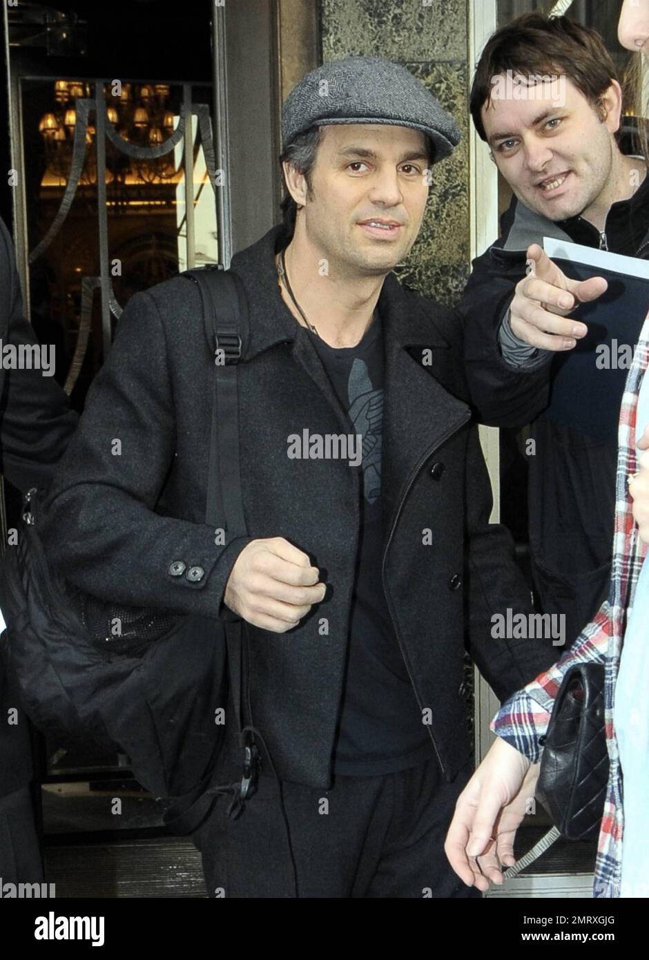 "The Kids Are Alright" star Mark Ruffalo flashes a peace sign while ...