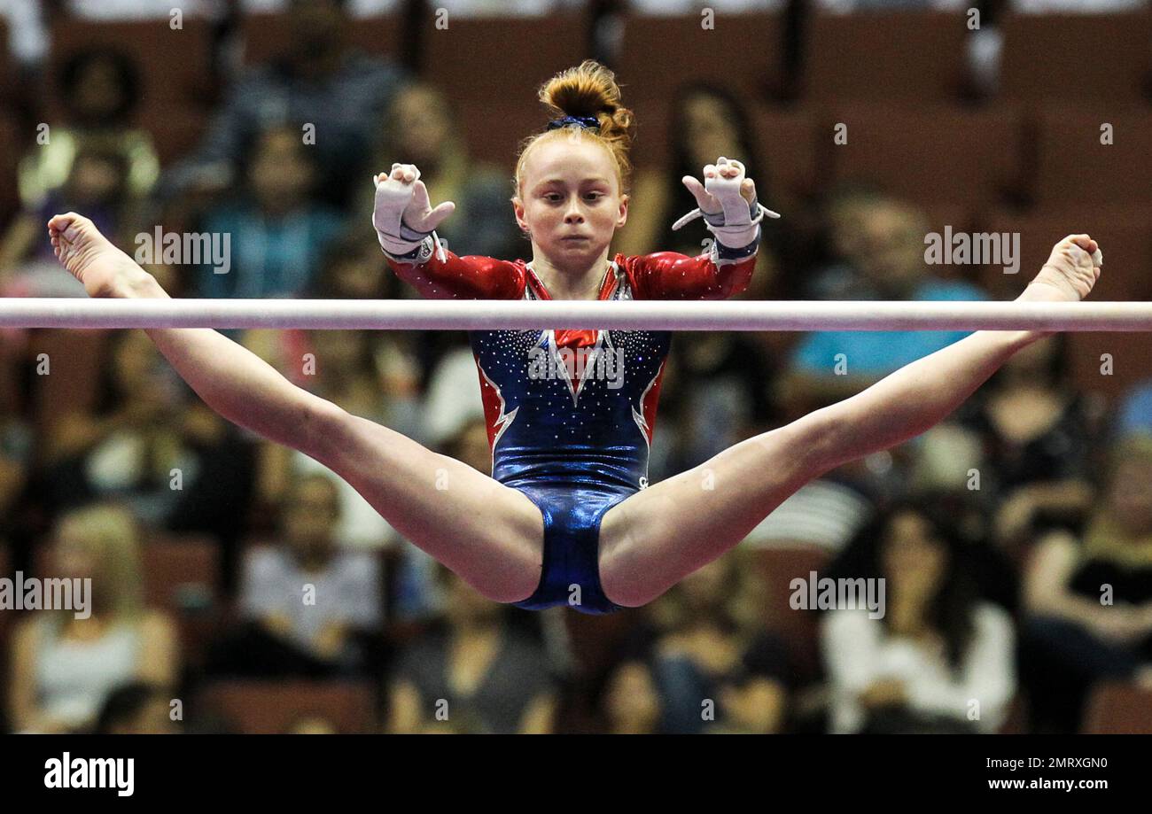 Hannah Hagle competes on the uneven parallel bars during the junior ...