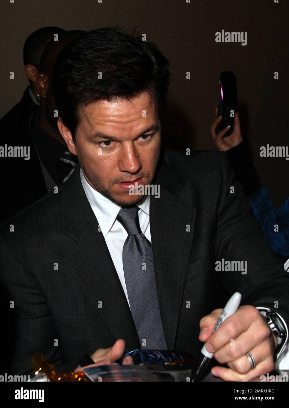 Mark Wahlberg signs autographs for and poses for photos with fans ...