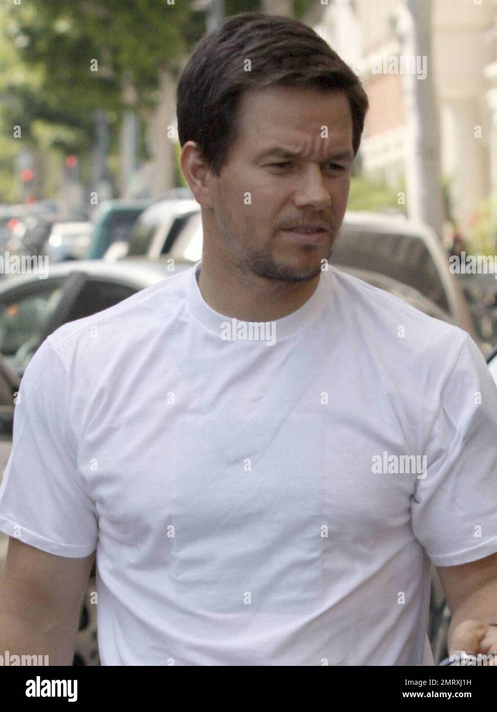 Mark Wahlberg heads toward his car after a visit to a medical building ...