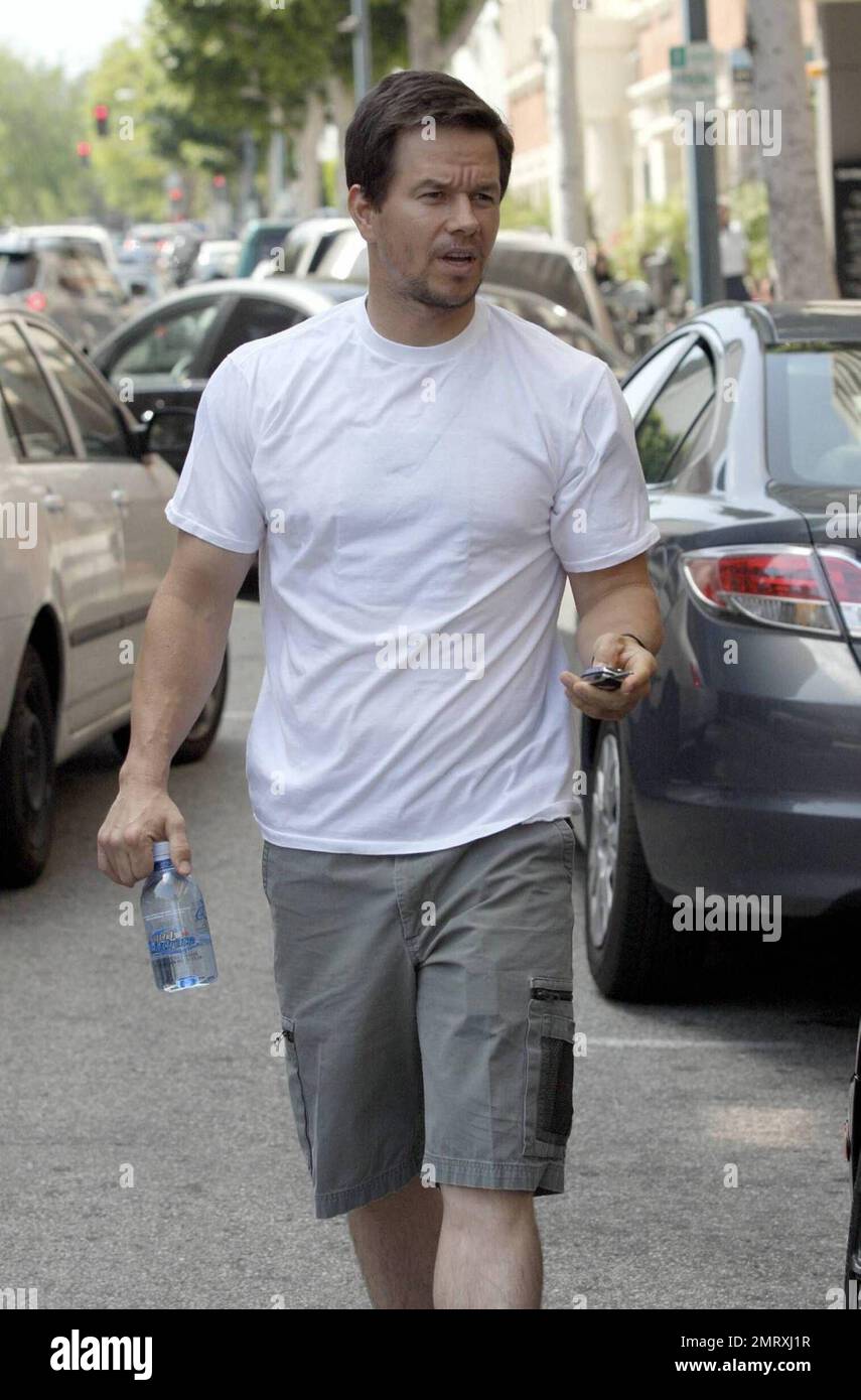 Mark Wahlberg heads toward his car after a visit to a medical building ...