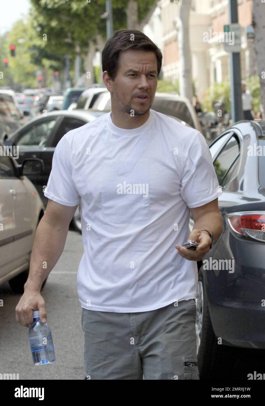 Mark Wahlberg heads toward his car after a visit to a medical building ...