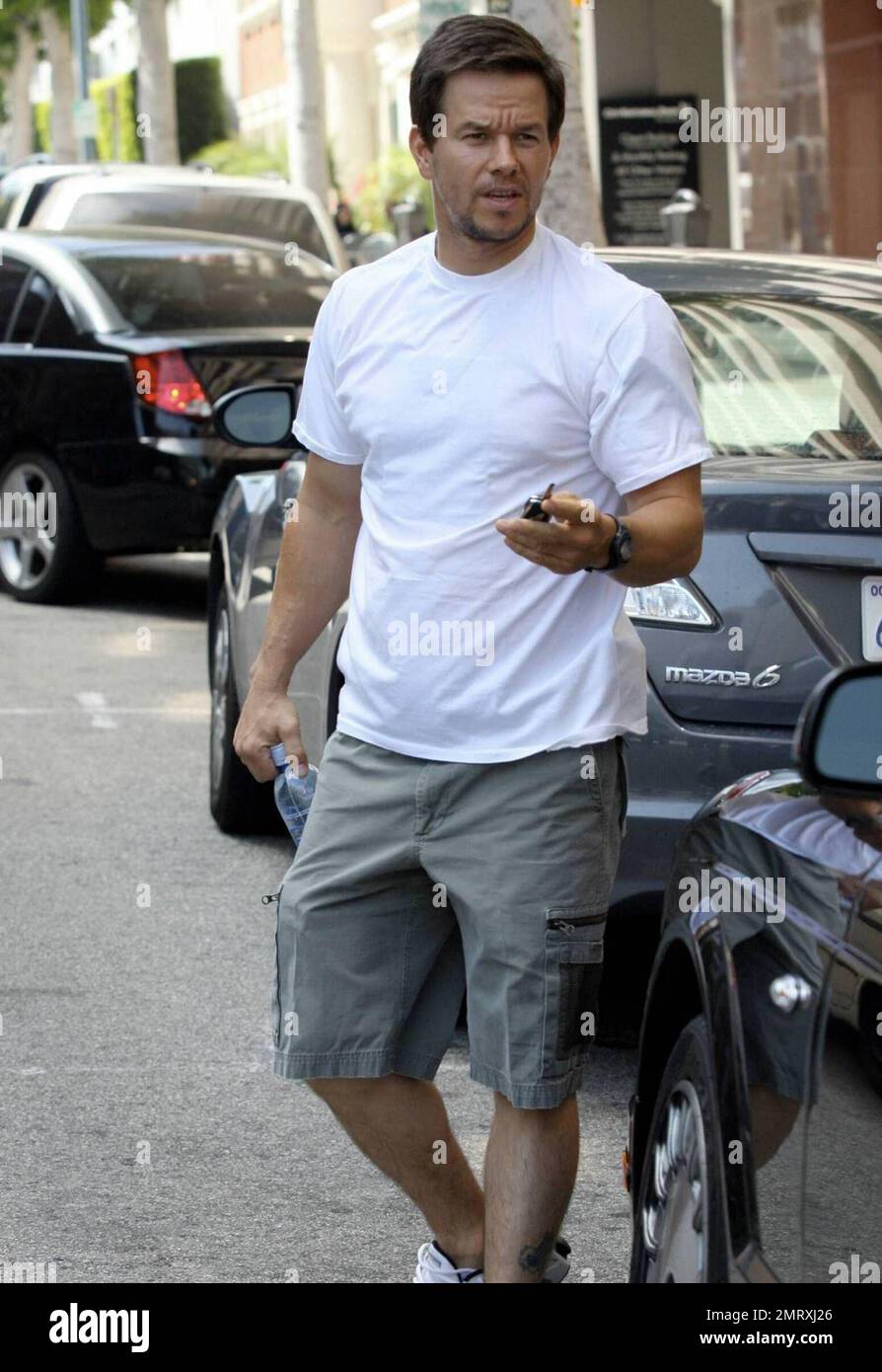 Mark Wahlberg heads toward his car after a visit to a medical building ...