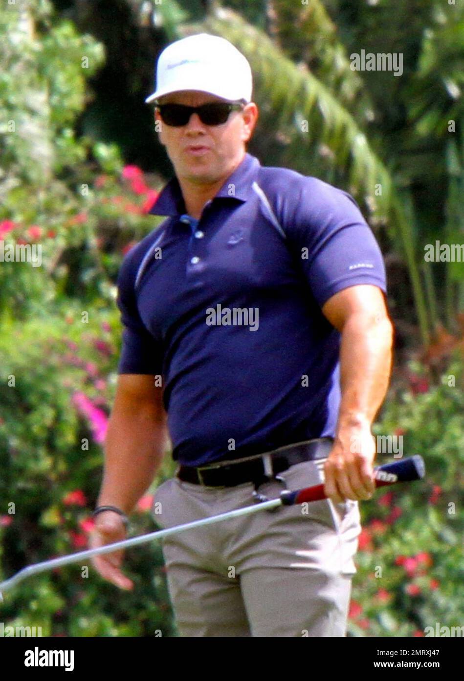 Taking a break from filming, actor Mark Wahlberg shows off his bulky ...