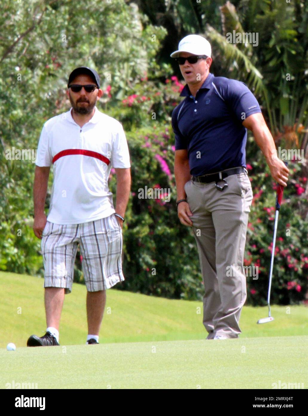 Taking a break from filming, actor Mark Wahlberg shows off his bulky ...