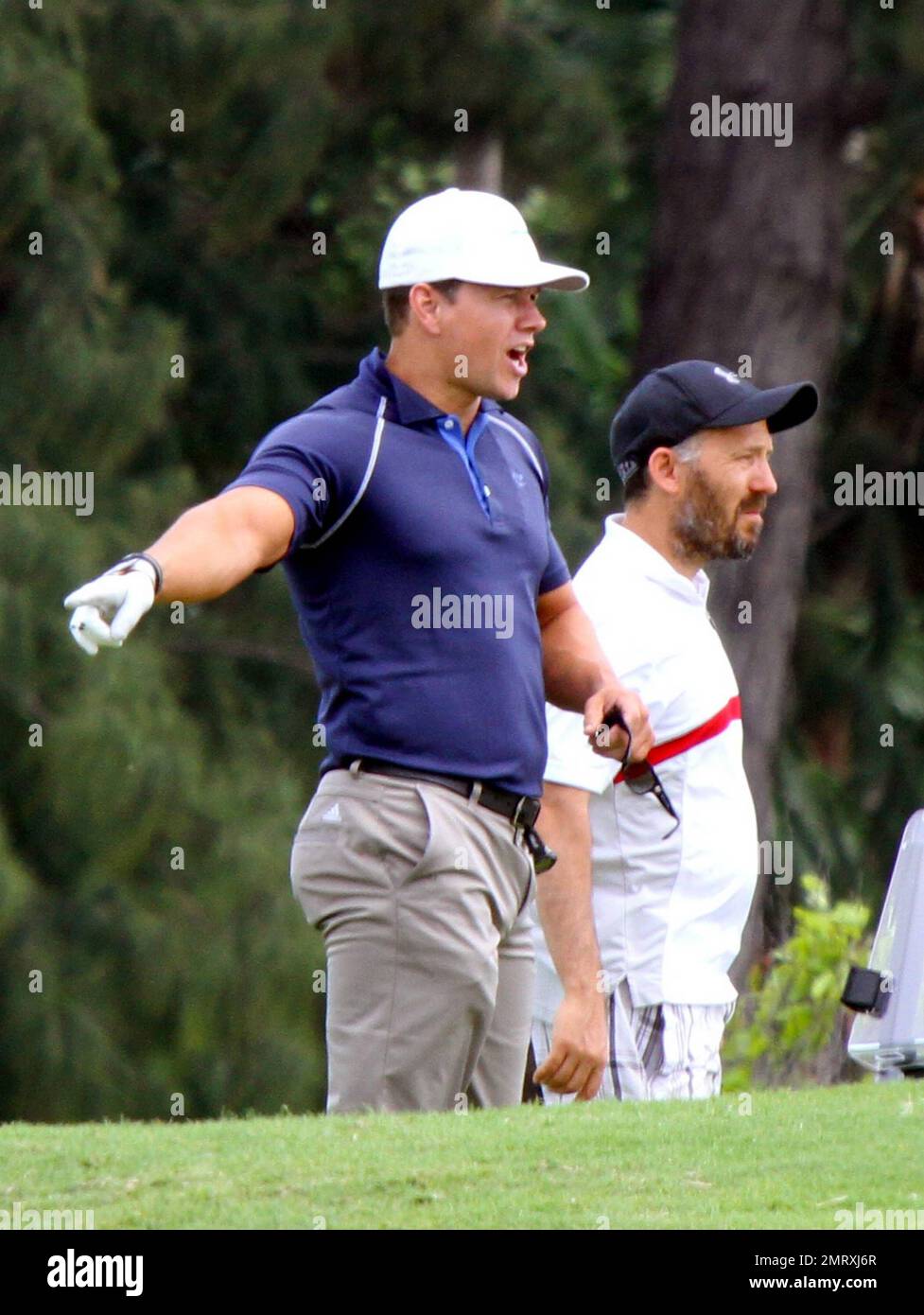 Taking a break from filming, actor Mark Wahlberg shows off his bulky ...