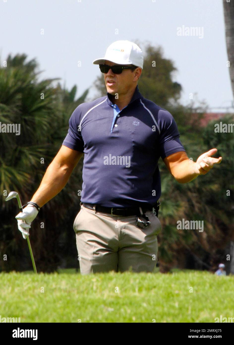 Taking a break from filming, actor Mark Wahlberg shows off his bulky ...