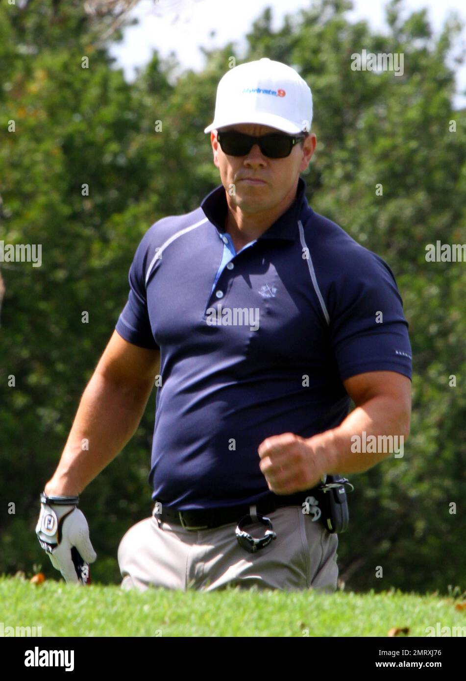 Taking a break from filming, actor Mark Wahlberg shows off his bulky ...