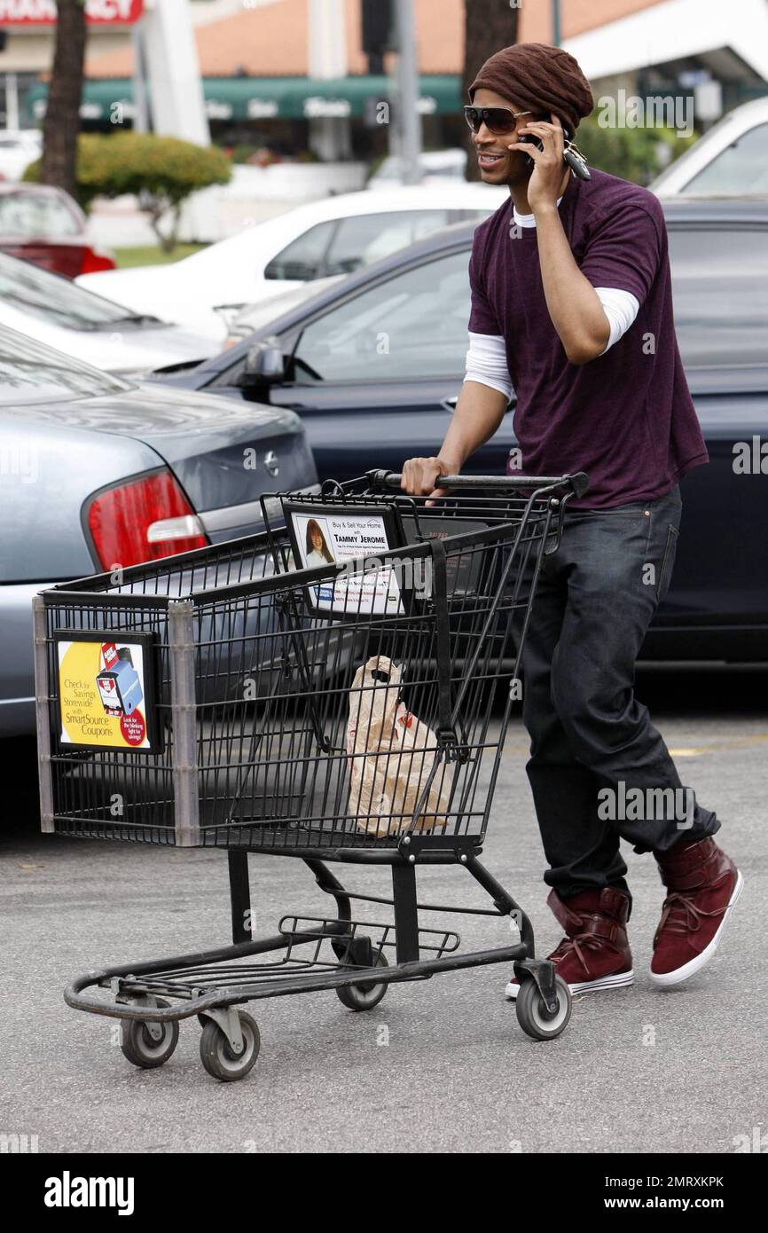 Actor and comedian Marlon Wayans chats on his cellphone while returning ...