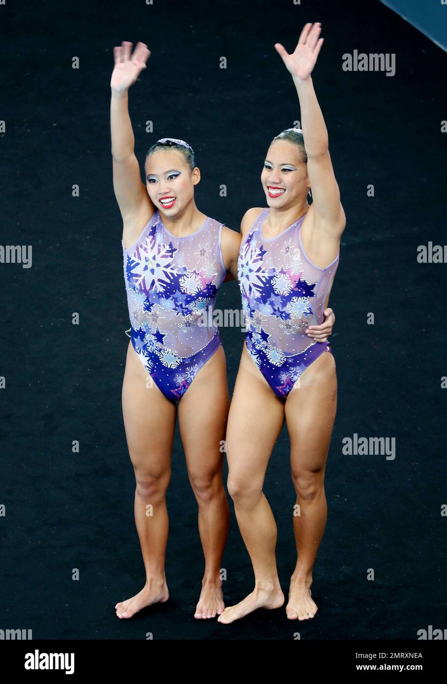 Malaysia's Gan Hua Wei, right, and Lee Ying Huey wave after the Duet Free Routine Synchronized ...