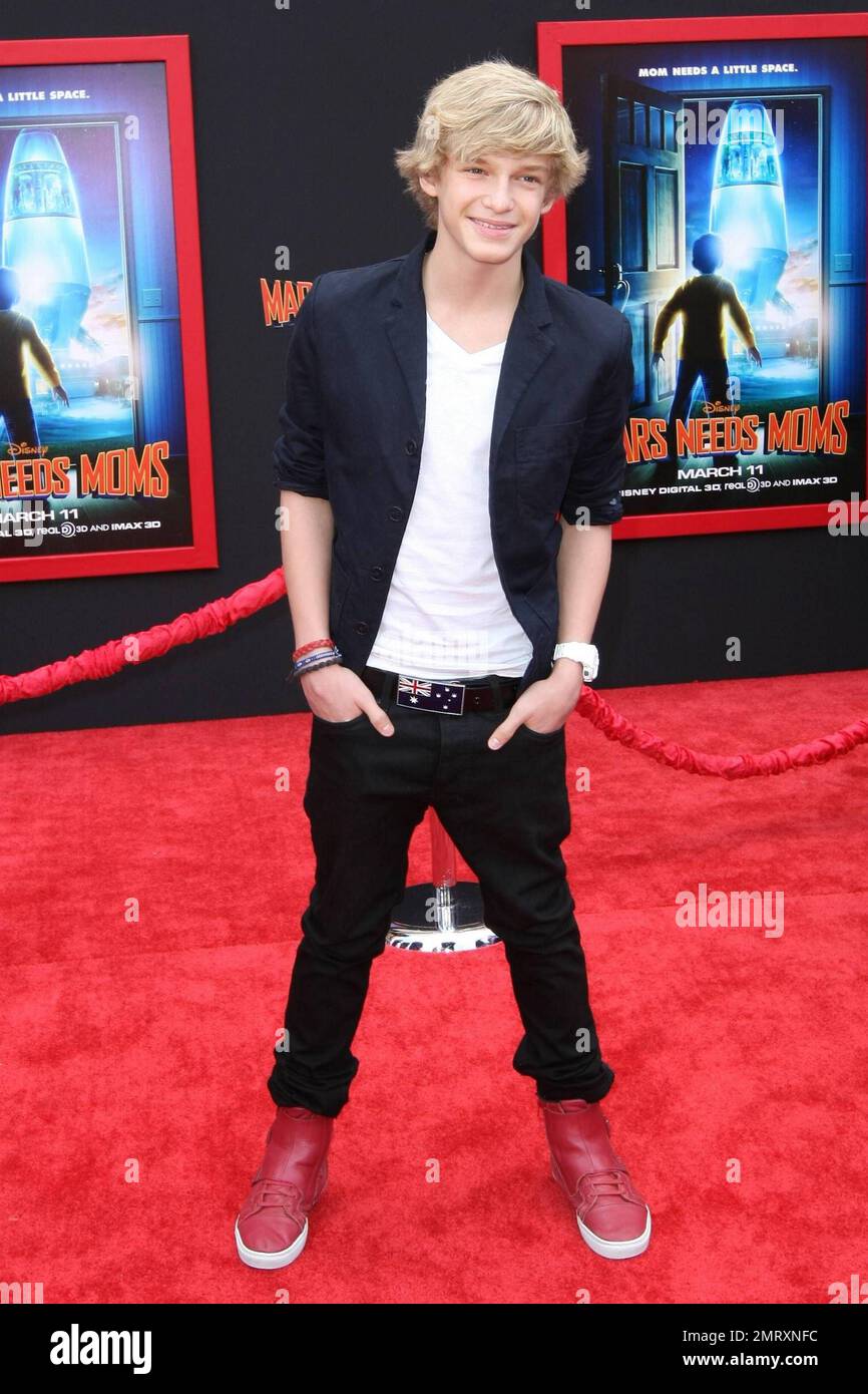 Cody Simpson poses for photographers on the red carpet at the premiere ...