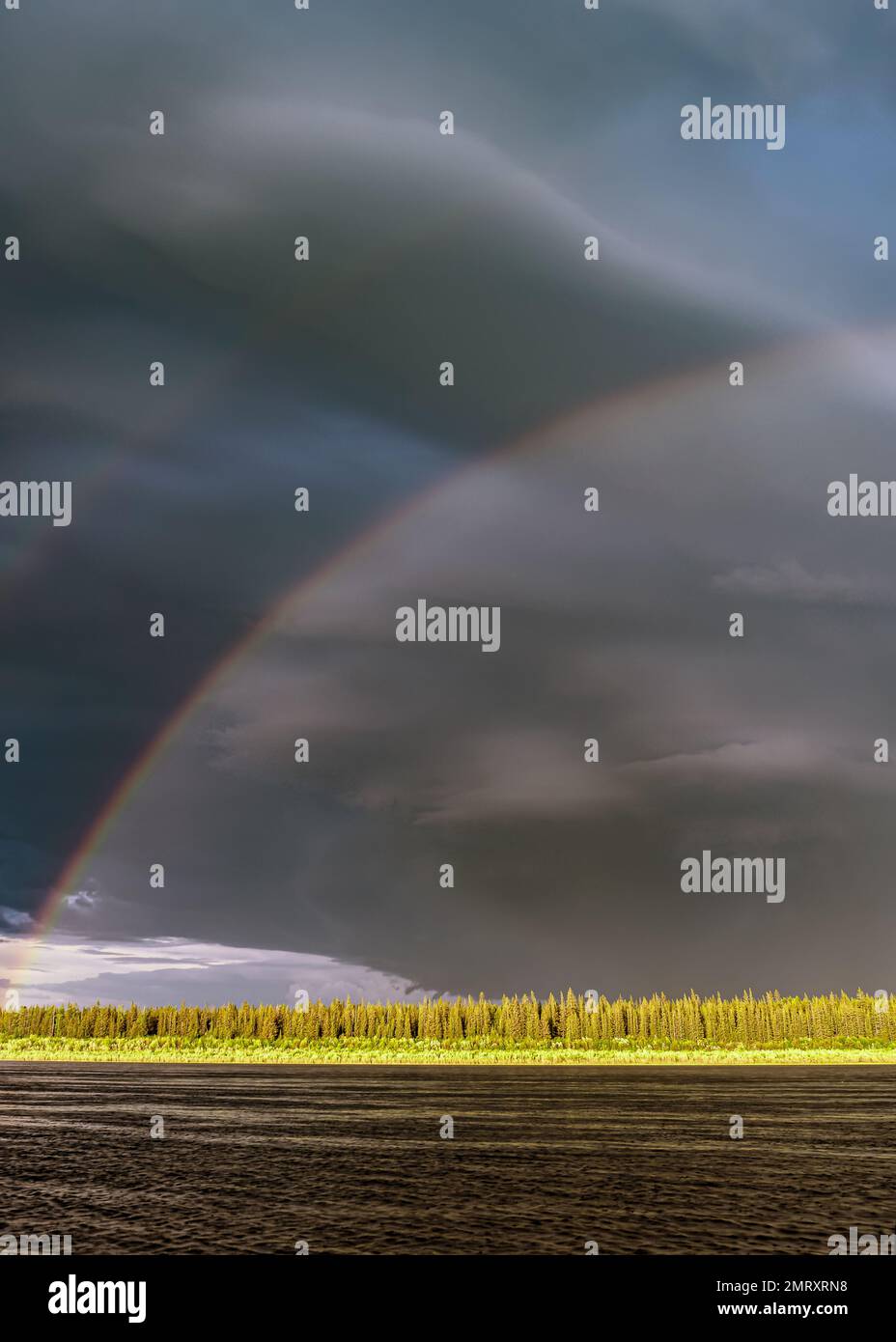 Double rainbow over the Vilyui River against the background of the sky ...