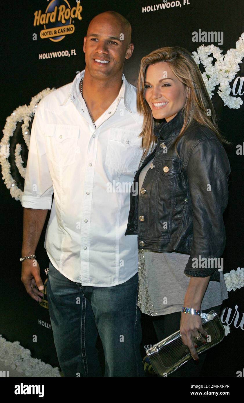 Football great Jason Taylor and his wife Katina appear at the "Fantastico" grand opening ...