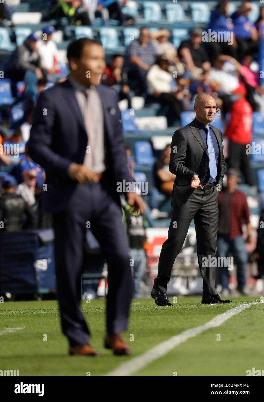 Cruz Azul coach Francisco Jemez, right, and Atlas coach Jose Cruz guide ...