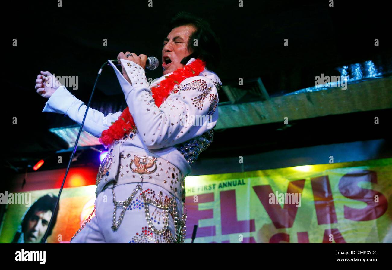 Elvis impersonator Tatsuro Nagata of Japan performs during the finals ...