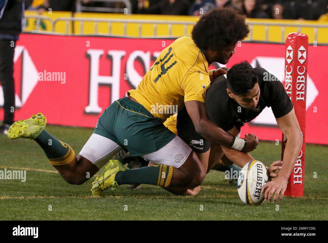 New Zealand's Rieko Ioane, right, scores a try as Australia's Henry ...