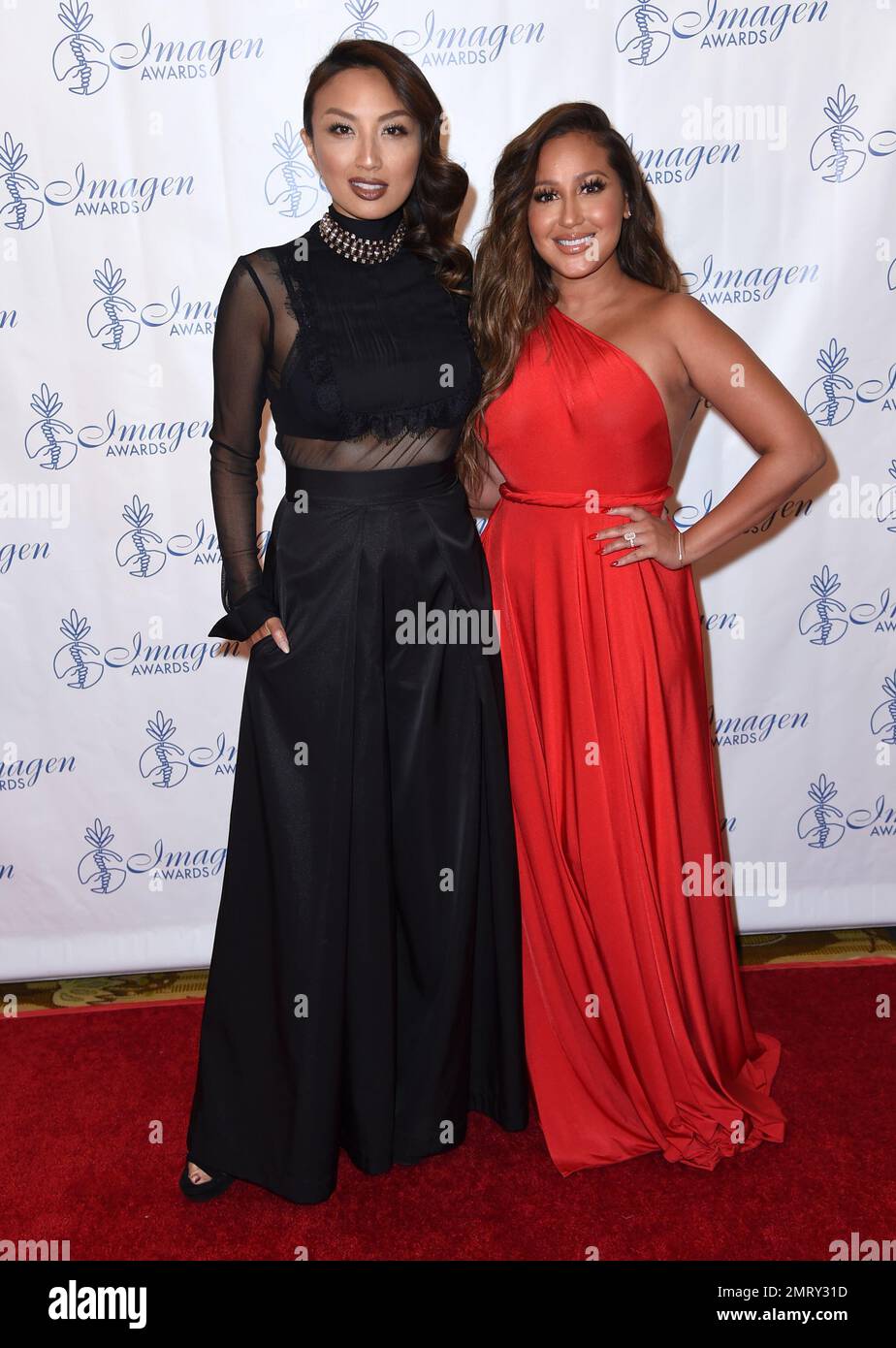 Jeannie Mai, left, and Adrienne Bailon arrive at the 32nd annual Imagen ...