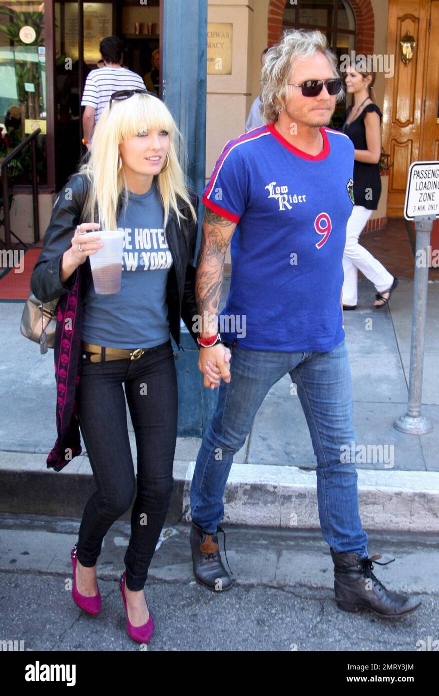 Former Guns N' Roses and Velvet Revolver drummer Matt Sorum holds hands ...